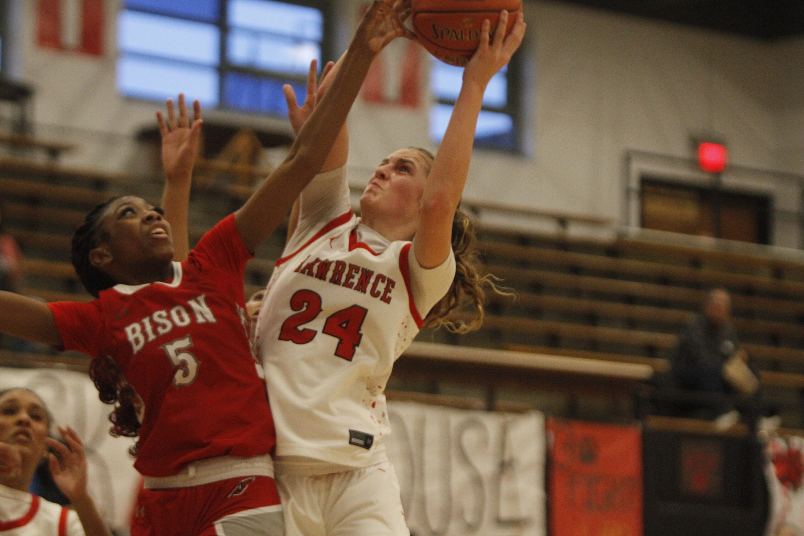 Lawrence girls basketball wins, boys lose in penultimate regular season ...